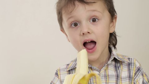 Portrait Little Boy Biting Banana Home Stock Footage Video (100% ...