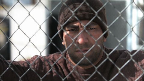 Homeless Man Peering Through Chain Link Stock Footage Video (100% ...