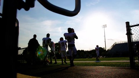 Football Players Coaches Walk On Field Stock Footage Video (100% ...