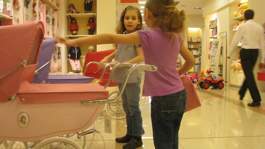 two girls play toy carriages dolls Stock Footage Video (100% Royalty ...