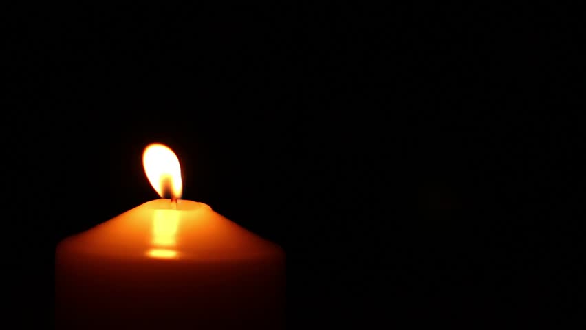 big single candle burning on dark Stock Footage Video (100% Royalty ...