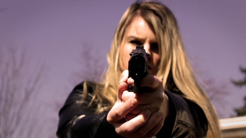 female secret agent aims pistol camera Stock Footage Video (100% ...