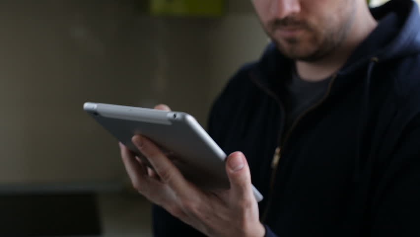 man standing tablet by window home Stock Footage Video (100% Royalty ...