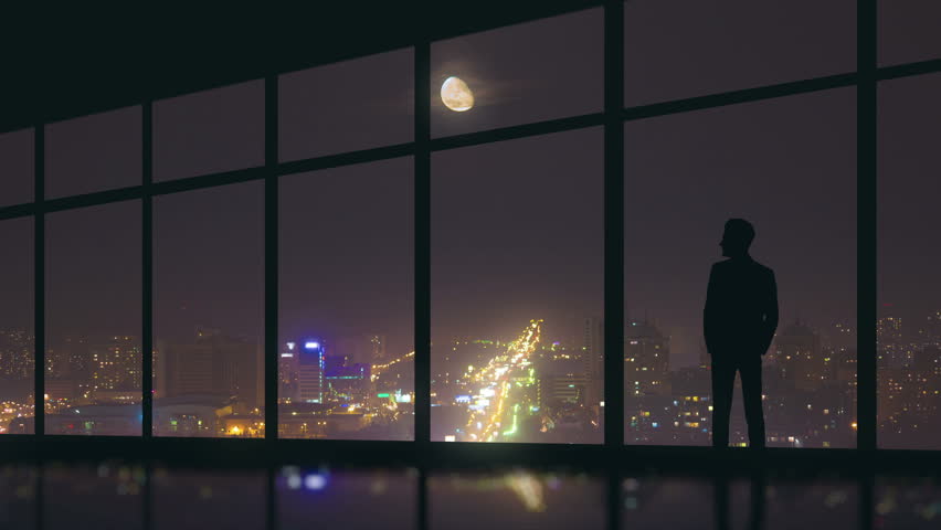 man standing near window on night Stock Footage Video (100% Royalty ...