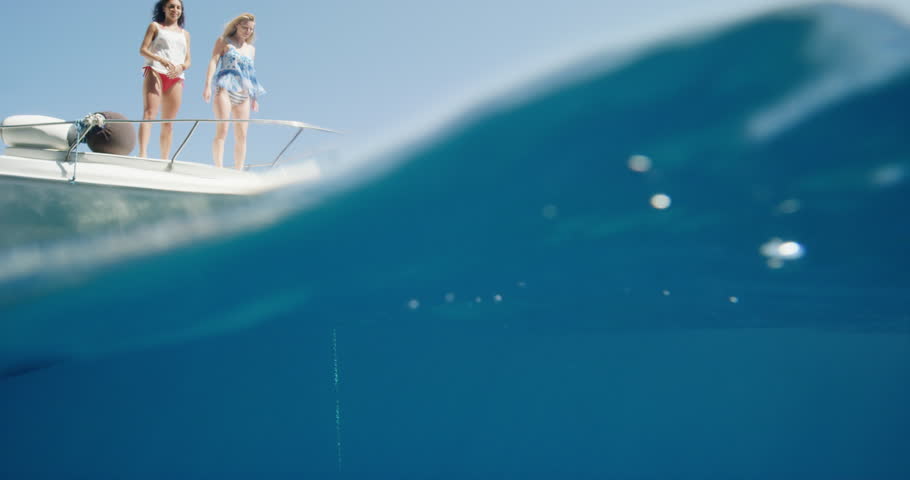 women jumping off boat into ocean Stock Footage Video (100% Royalty ...