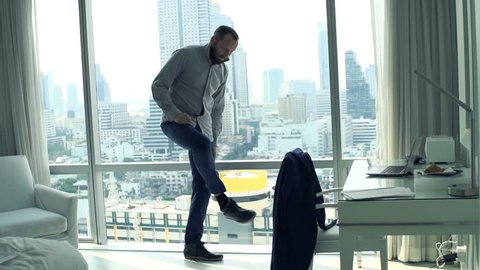 Man taking off shoe Stock Video Footage - 4K and HD Video Clips ...