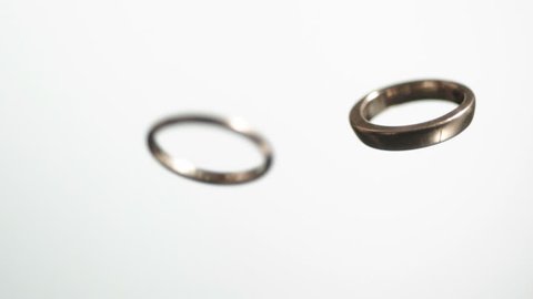 Studio Shot Two Wedding Rings Falling Stock Footage Video (100% Royalty ...