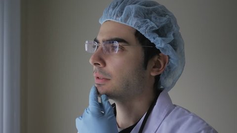 Young Doctor Looking Far Away Thinking Stock Footage Video (100% ...