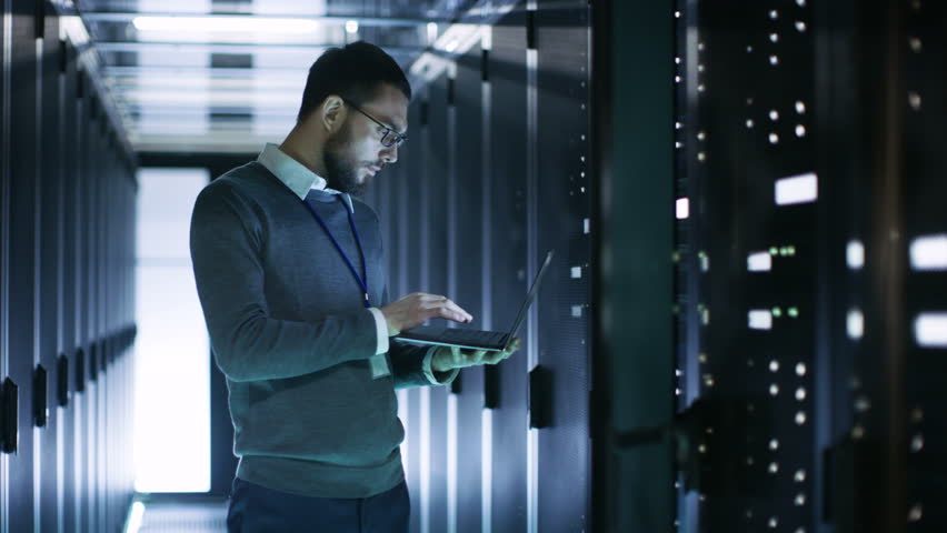 male technician working on laptop standing Stock Footage Video (100% ...