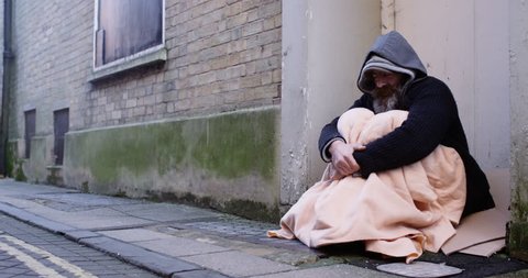 4k Homeless Man Sitting On Sidewalk Stock Footage Video (100% Royalty ...