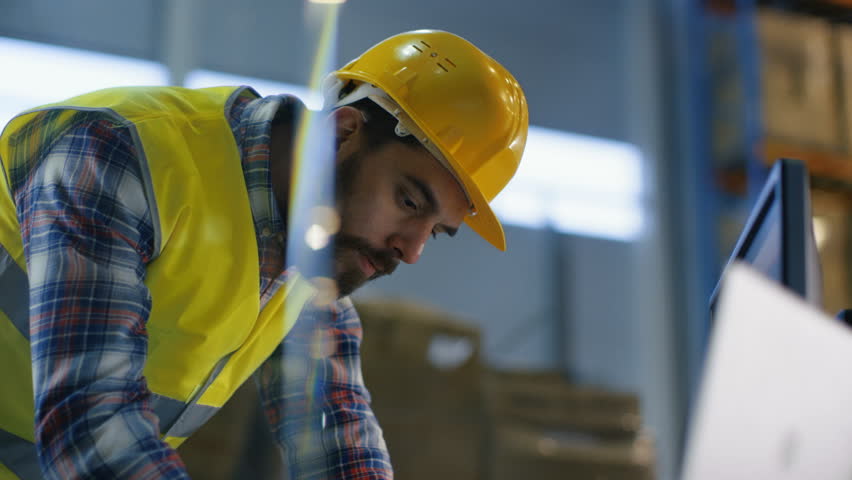 male inspector wearing hard hat fills Stock Footage Video (100% Royalty ...