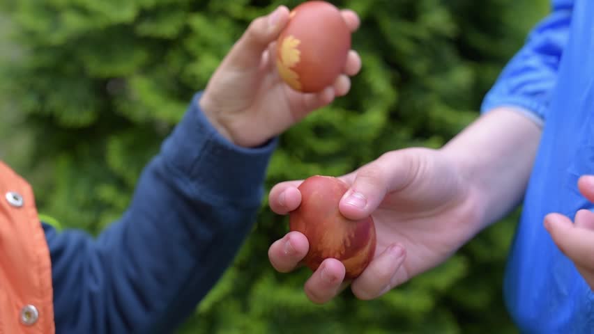 brother sister knocking easter eggs Stock Footage Video (100% Royalty ...