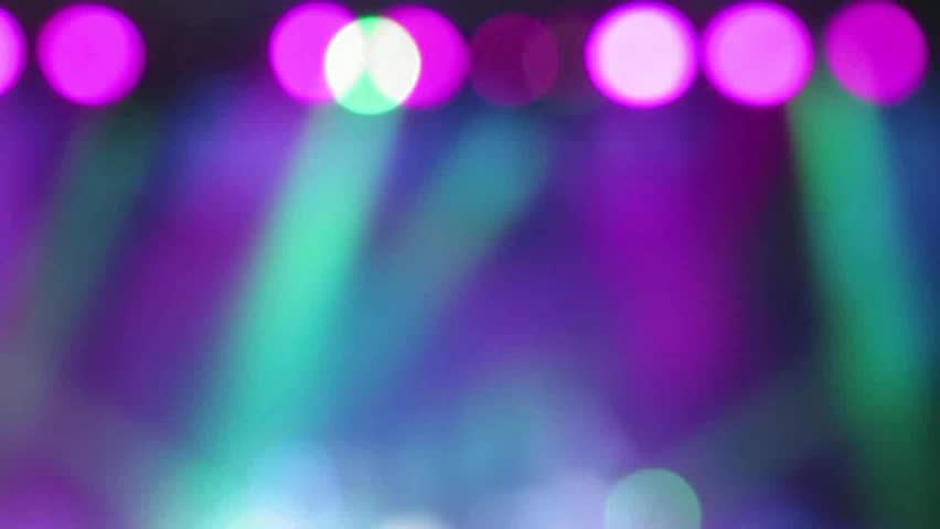 background bright light beams multi-colored spotlights: วิดีโอสต็อก ...