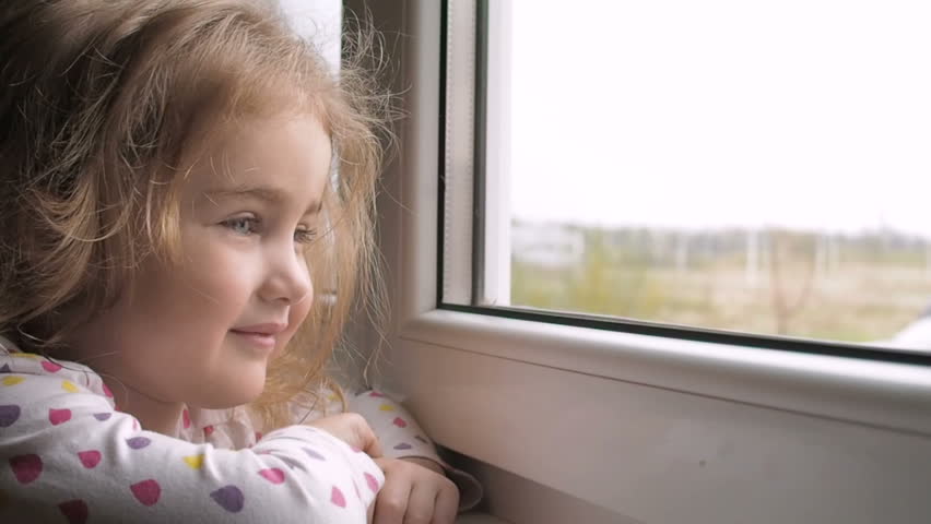 little girl smiling looking out window Stock Footage Video (100% ...