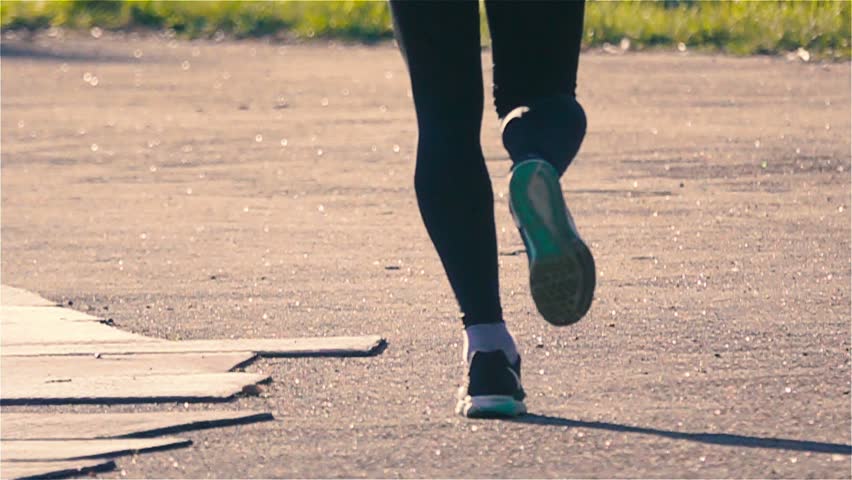 rear view runner running around stadium Stock Footage Video (100% ...