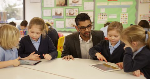 4k School Children Male Teacher Working Stock Footage Video (100% ...