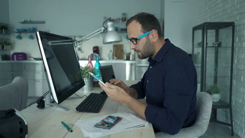 Busy Multitasking Man Working Home By Stock Footage Video (100% Royalty ...