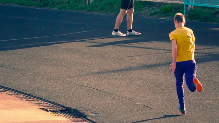 guy slow motion runs around stadium Stock Footage Video (100% Royalty ...