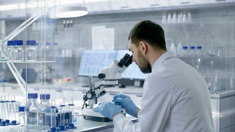 Research Scientist Looks Into Microscope Research Stock Photo 685086631 ...