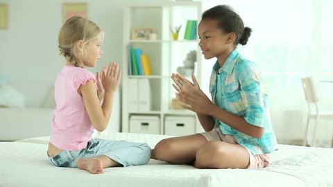 Cheerful Girls Sitting On Bed Clapping Stock Footage Video (100% ...