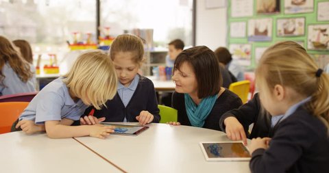 4k School Children Female Teacher Working Stock Footage Video (100% ...