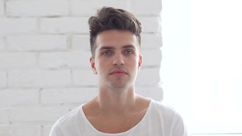 Quizzical Man Raising Eyebrow Portrait Stock Photo (Edit Now) 451135087