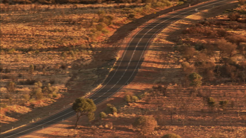 zoom-out on lonely highway australia's outback Stock Footage Video (100 ...