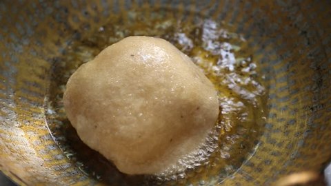 deep frying puri poori recipe Stock Footage Video (100% Royalty-free ...