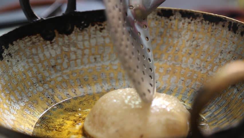 deep frying puri poori recipe Stock Footage Video (100% Royalty-free ...