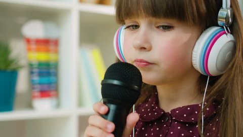 Close Cute Little Girl Singing On Stock Footage Video (100% Royalty ...