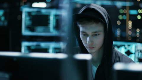 Hooded Teenage Hacker Successfully Attacks Global Stock Footage Video ...