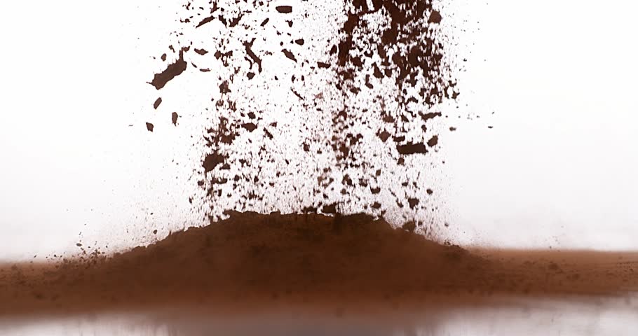 chocolate powder falling against white background Stock Footage Video ...