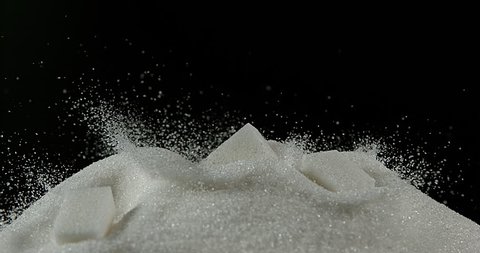 White Sugar Cubes Falling Against Black Stock Footage Video (100% ...