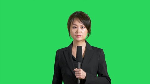 Chinese News Reporter Presenter On Green Stock Footage Video (100% ...
