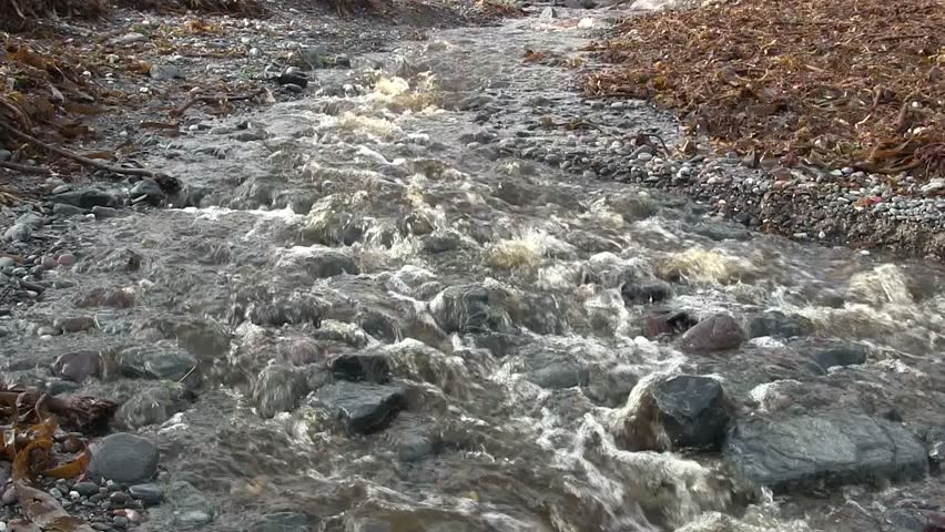 outlet stream flowing on beach Stock Footage Video (100% Royalty-free ...