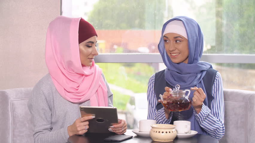 muslim women talk cafes use mobile Stock Footage Video (100% Royalty ...