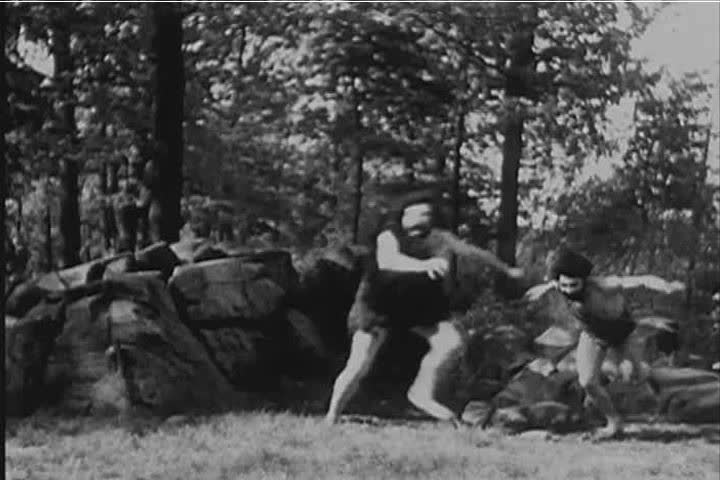 1920s: Cavemen Climb Trees and Stock Footage Video (100% Royalty-free ...