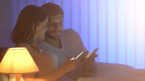 Man Woman Phone On Bed Night Stock Footage Video (100% Royalty-free ...