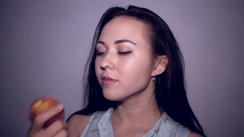 Young Beautiful Girl Biting Peach Looking Stock Footage Video (100% ...