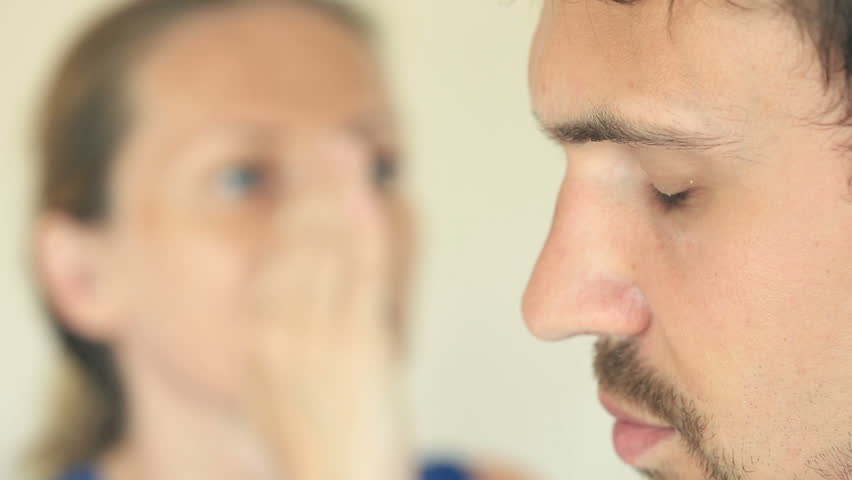 woman whispers man's ear secret he's Stock Footage Video (100% Royalty ...