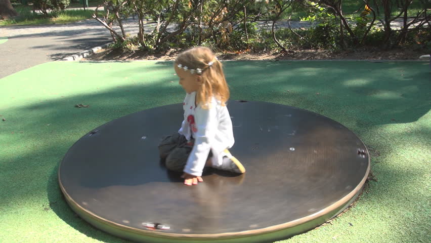 child spinning rotating on merry-go-round little Stock Footage Video ...