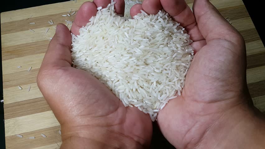Hand Pouring Rice Stock Footage Video (100% Royalty-free) 28394545 ...