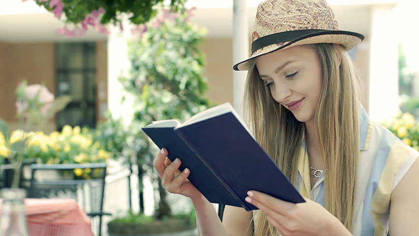 Pretty Girl Reading Book in Stock Footage Video (100% Royalty-free ...