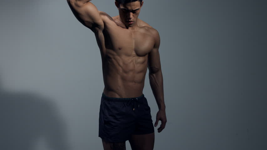 male fitness model flexes his abdominal Stock Footage Video (100% ...