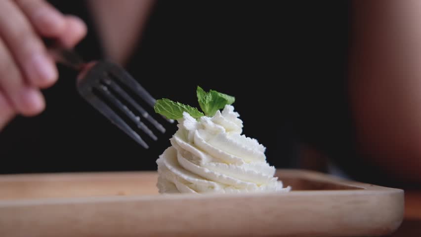 woman eating whipped cream on wooden Stock Footage Video (100% Royalty ...