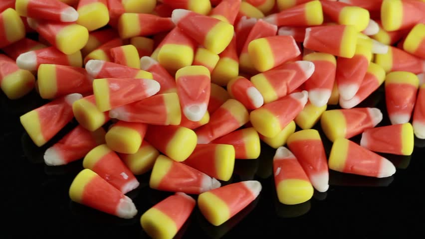 candy corn rotating on black mirror Stock Footage Video (100% Royalty ...