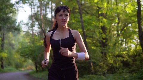 Young Woman Runner Running Down Road Stock Footage Video (100% Royalty ...