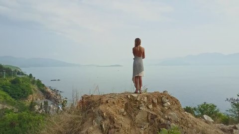 woman urinating on beach looking around Stock Footage Video (100% ...