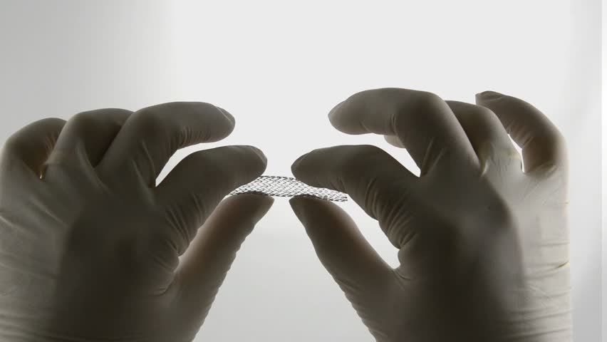 surgeon's hands stretching compressing bending cell-based Stock Footage ...