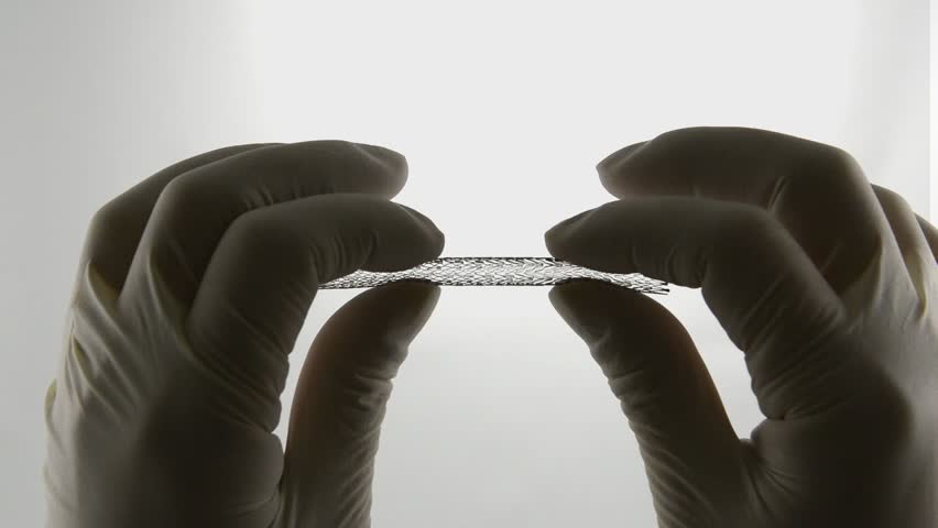 surgeon's hands stretching compressing bending self-expanding Stock ...